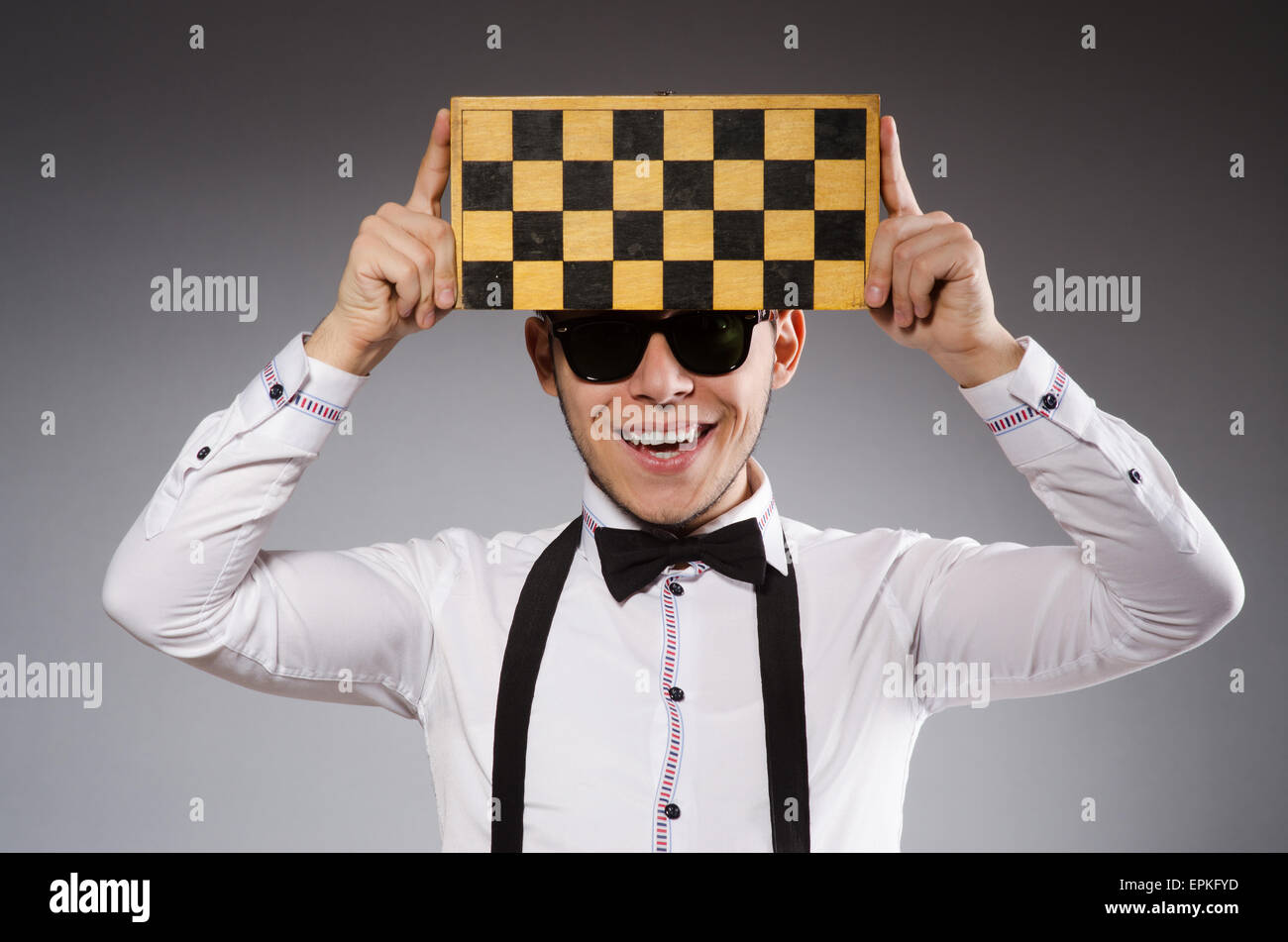 Funny chess player with board Stock Photo - Alamy