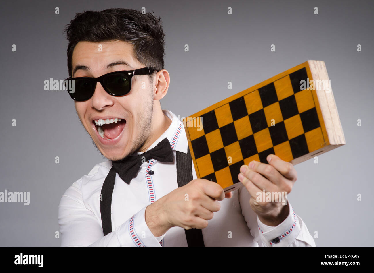 Funny chess player with board Stock Photo - Alamy