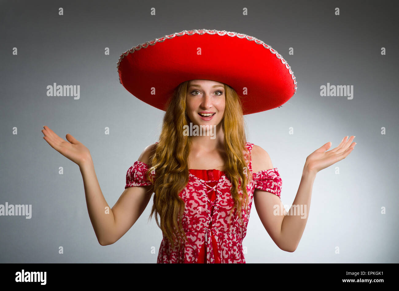 Mexican woman wearing red sombrero Stock Photo - Alamy