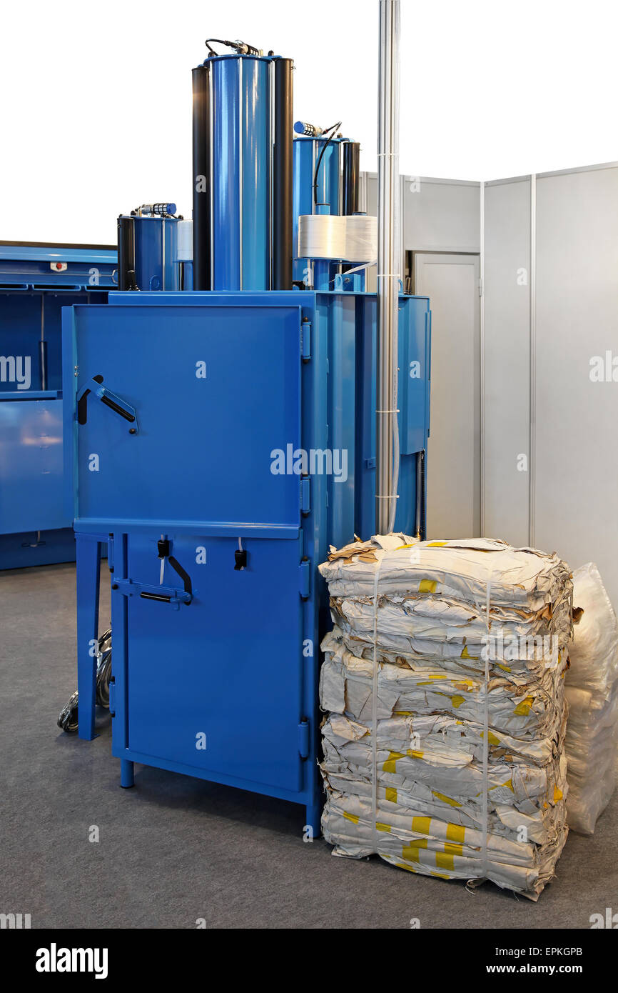Bale pressing machine Stock Photo - Alamy