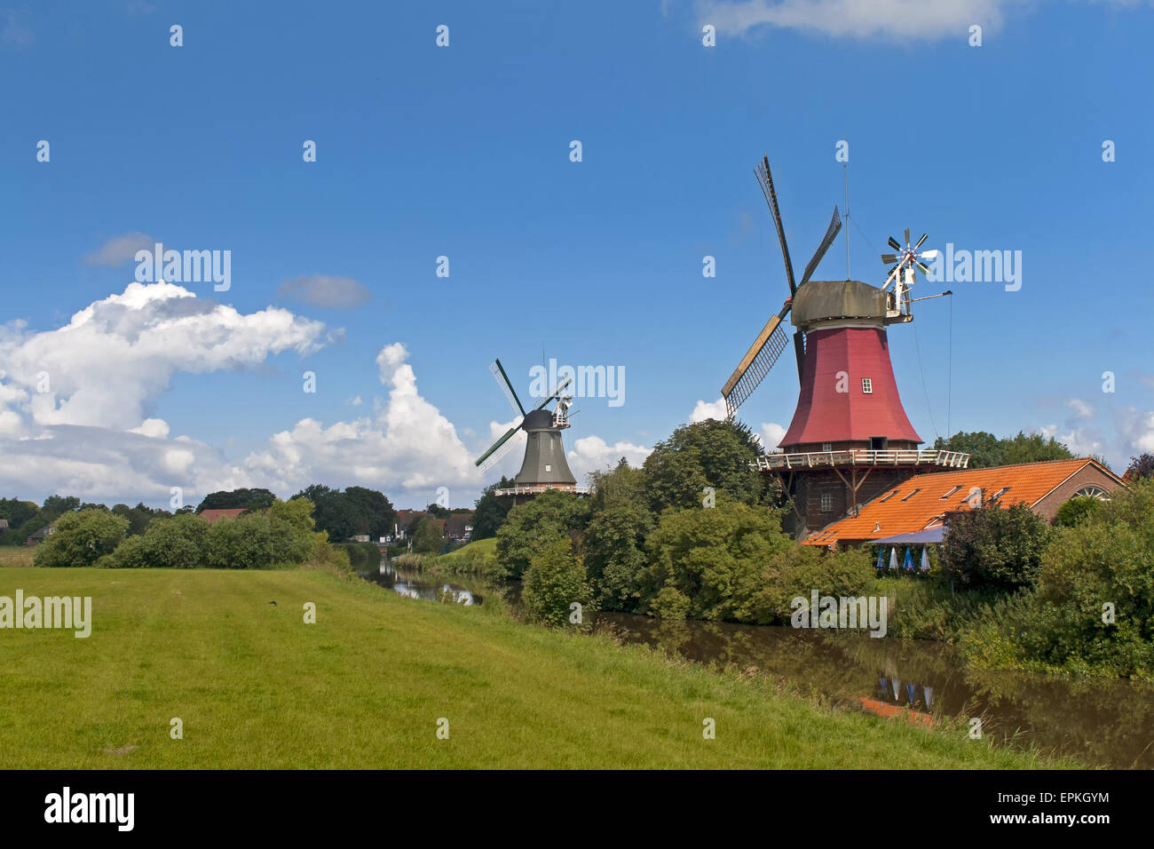 twin windmills greetsiel Stock Photo - Alamy