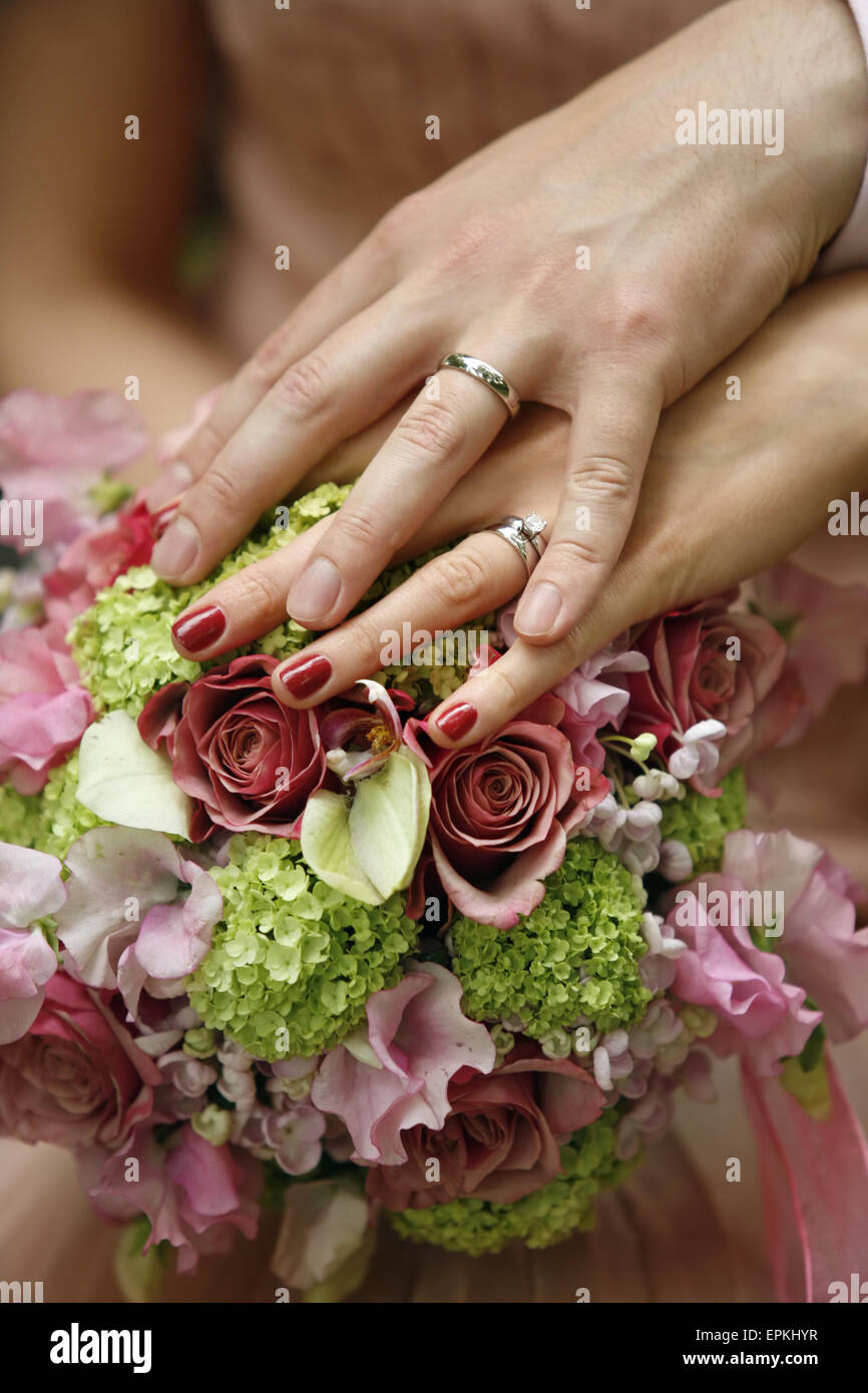 Husband wife putting wedding rings hi-res stock photography and images ...