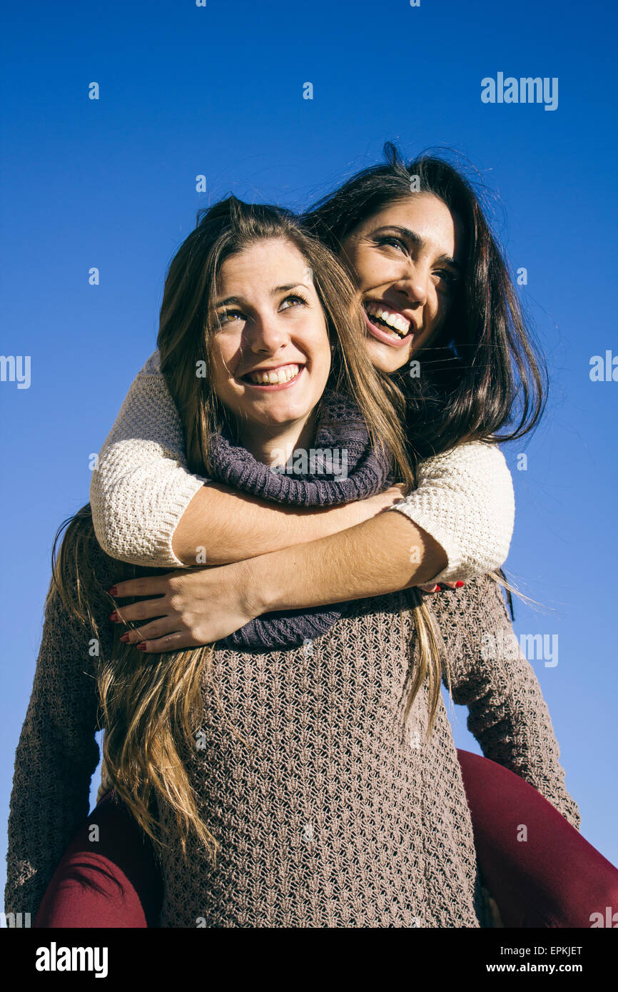 Two friends giving piggy back hi-res stock photography and images - Alamy