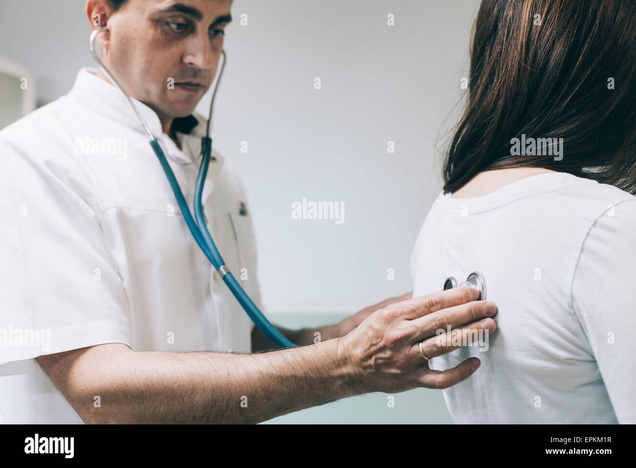 Doctor listening patients back stethoscope hi-res stock photography and ...