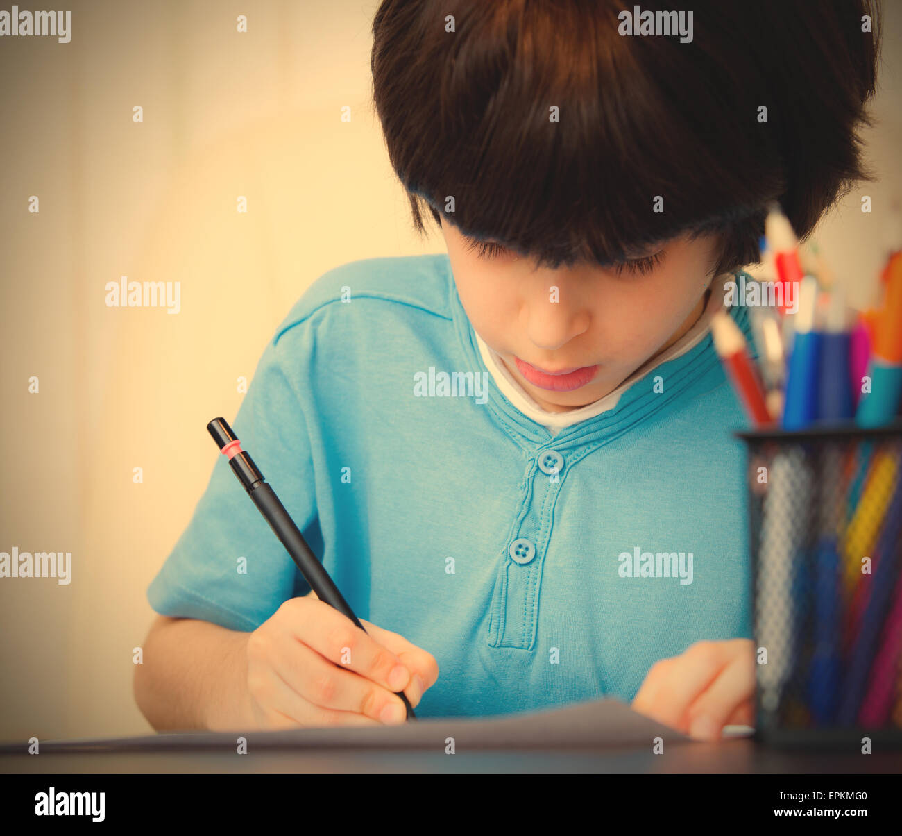 Boy doing homework Stock Photo - Alamy