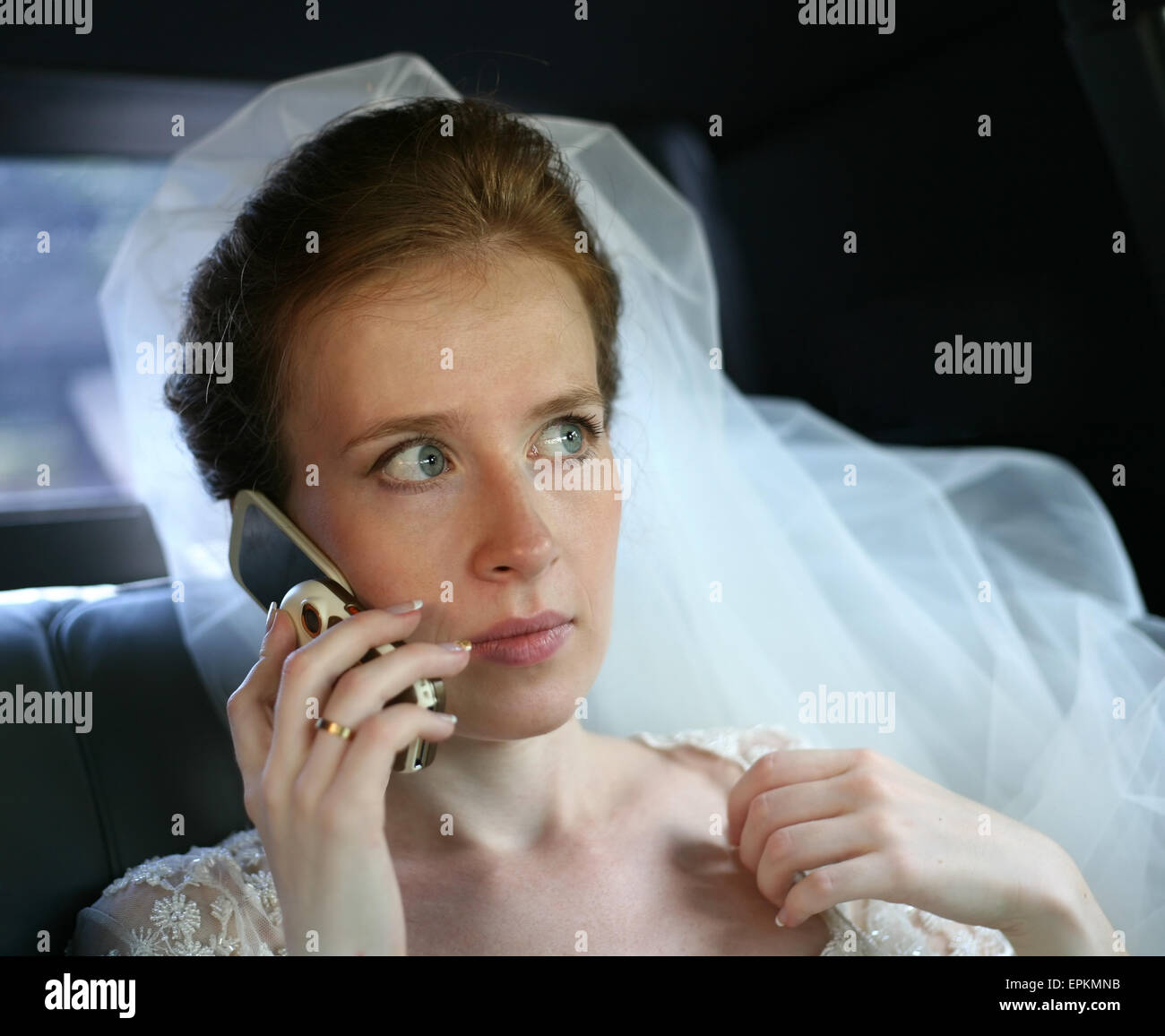 Bride with the phone Stock Photo - Alamy