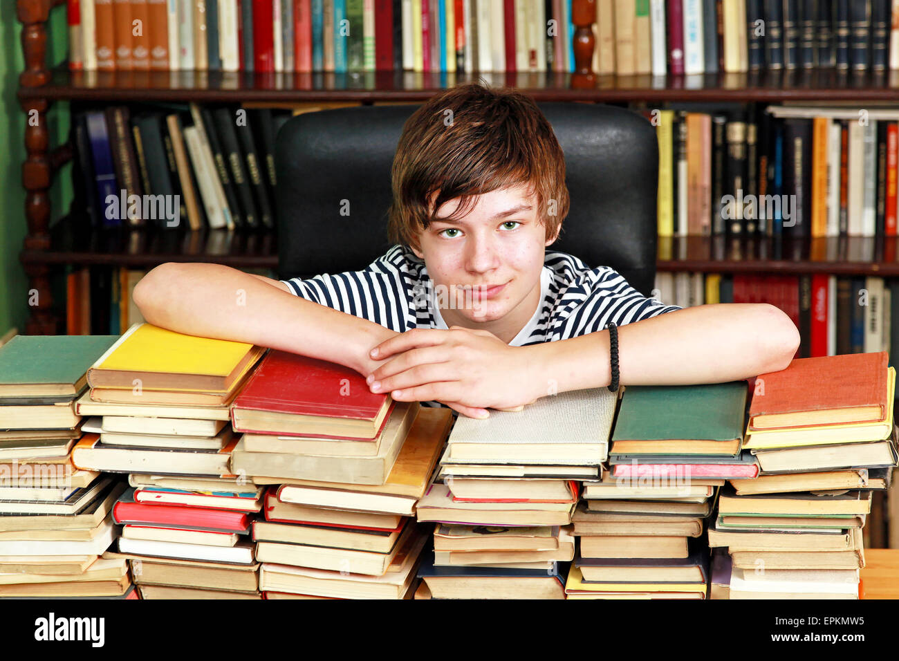 Teenager with books Stock Photo - Alamy