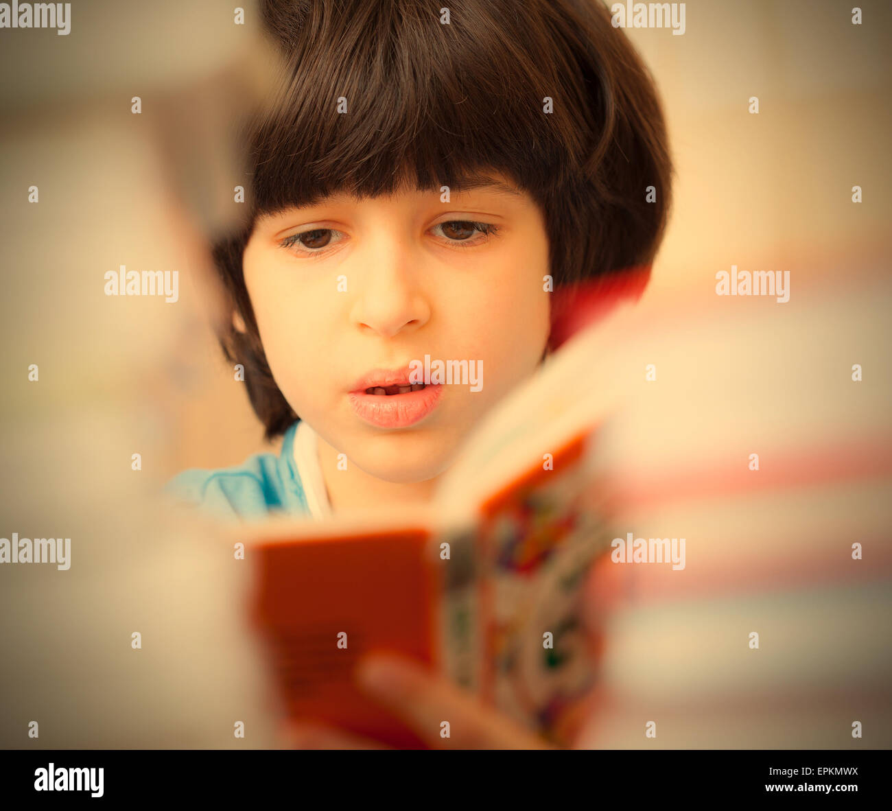 child reading a book Stock Photo - Alamy