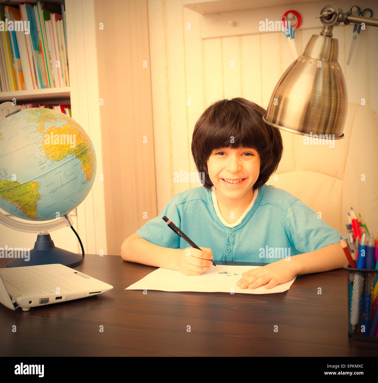 schoolboy doing homework Stock Photo - Alamy