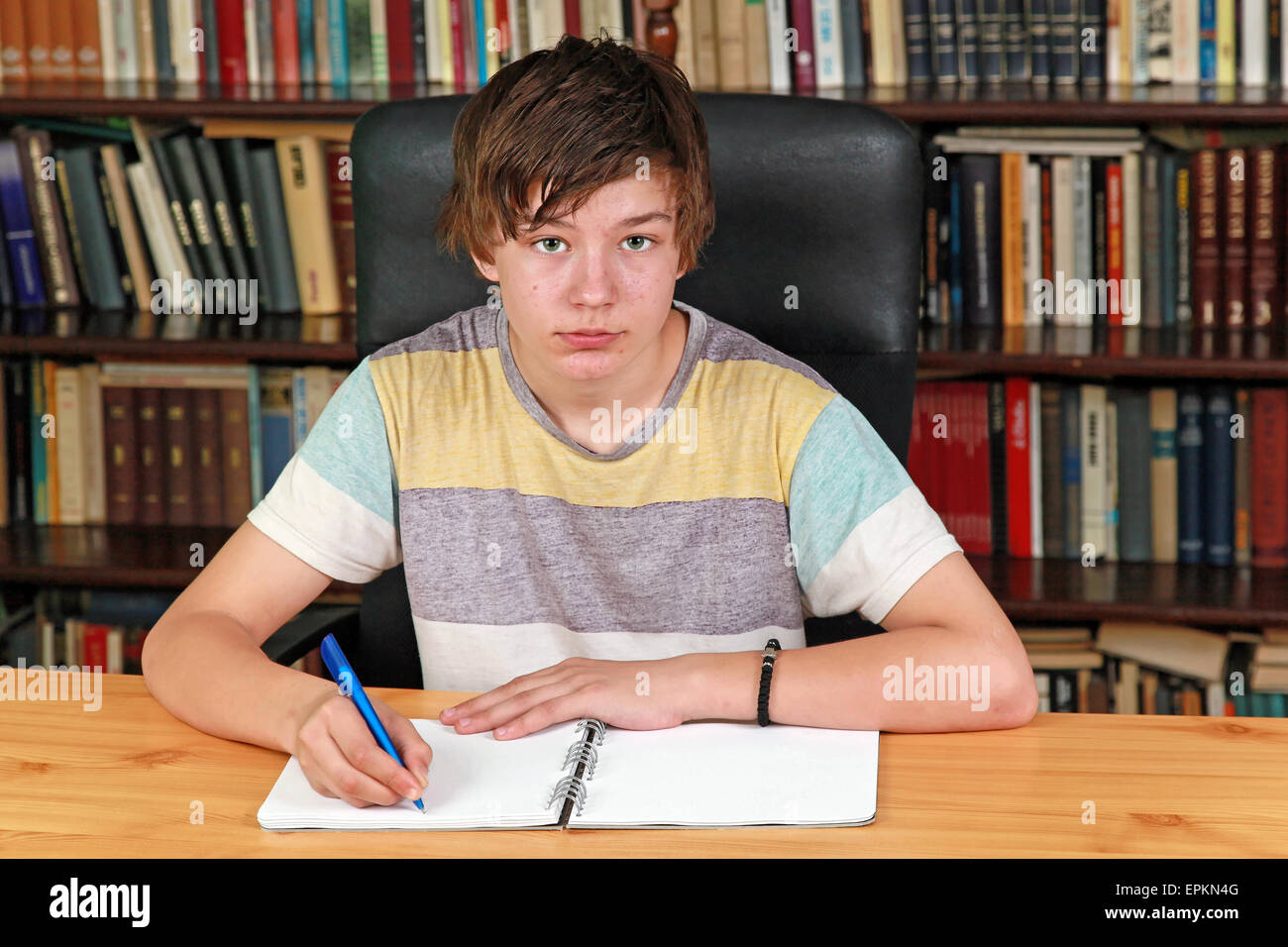 Boy writing book hi-res stock photography and images - Alamy
