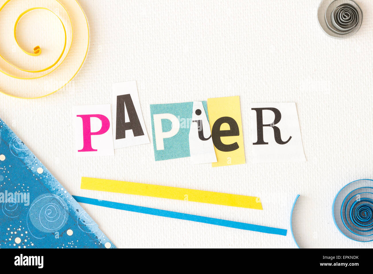 Writing 'Papier', wrapping paper and quilling elements Stock Photo - Alamy
