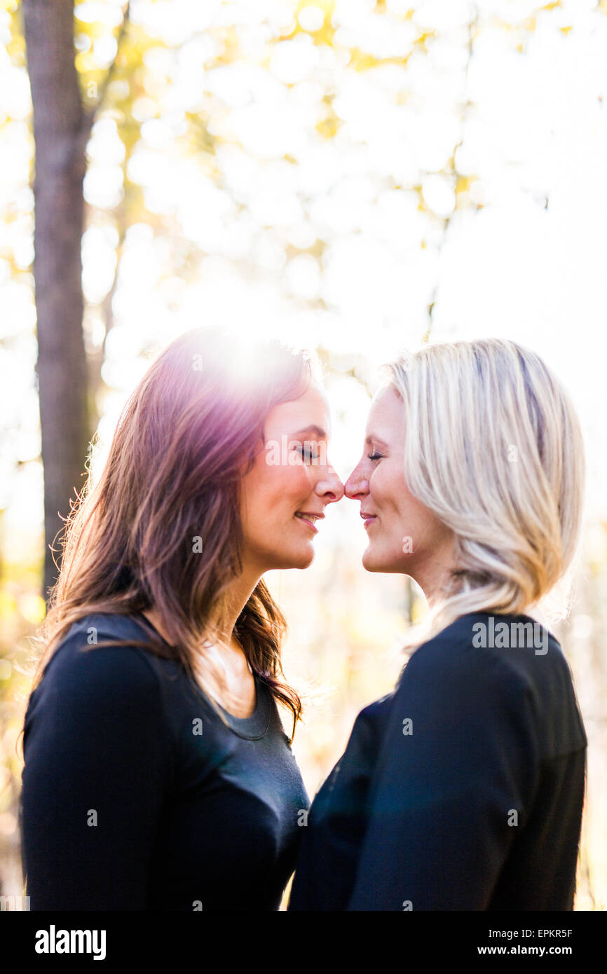 Lesbian couple rubbing noses Stock Photo - Alamy