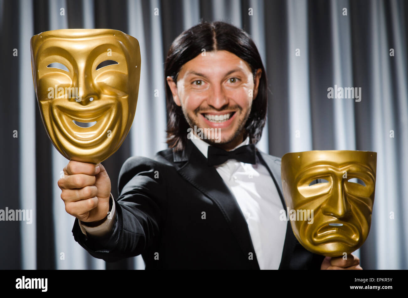 Funny concept with theatrical mask Stock Photo - Alamy