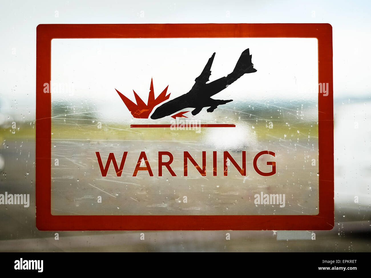 A Red Airport Security Warning Sign With Crashing Plane Stock Photo - Alamy