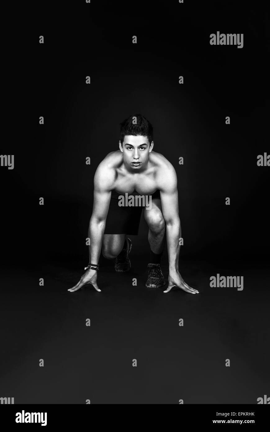 Young sportsman in starting position Stock Photo - Alamy