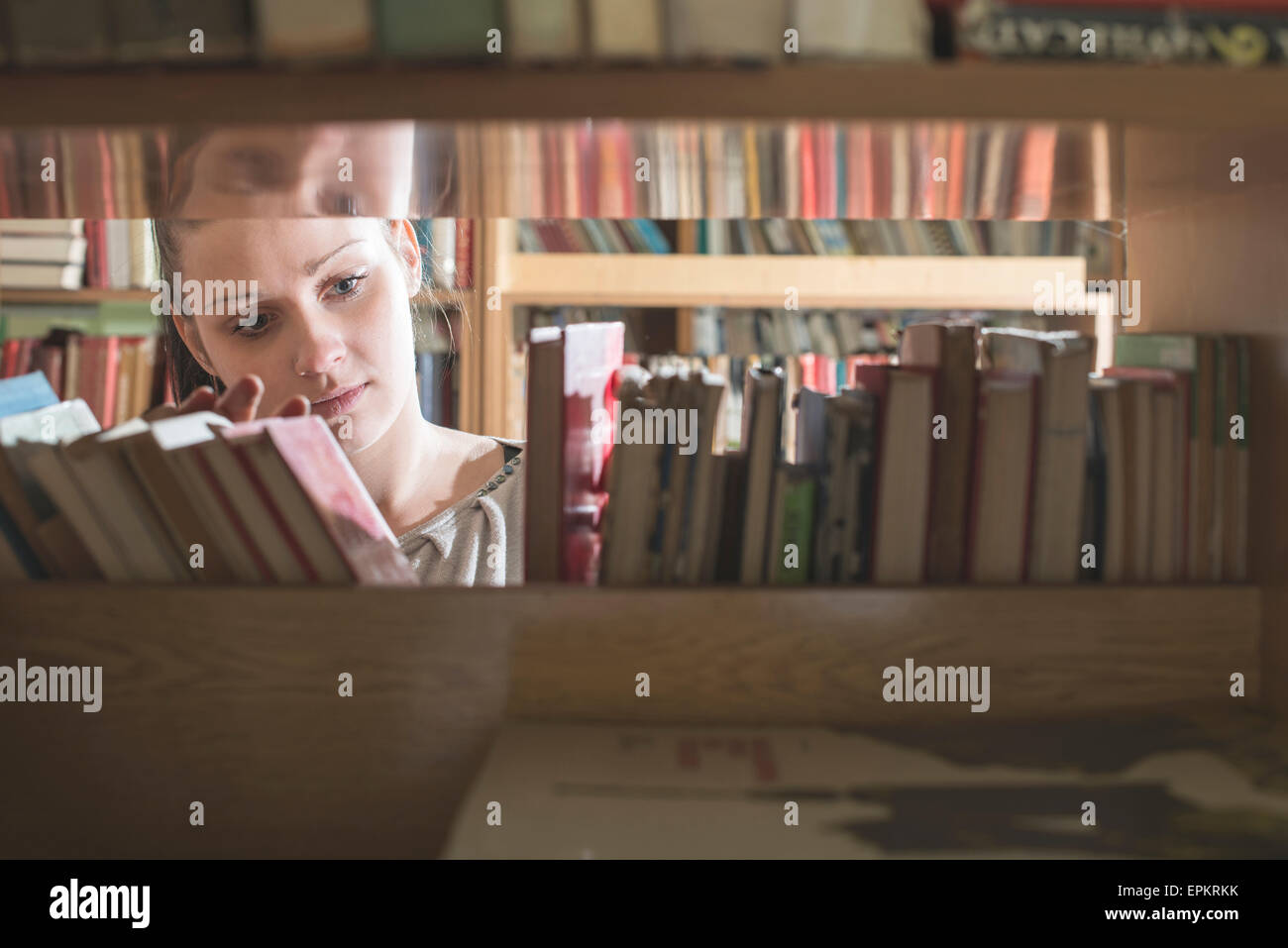 Female student searching books in the library Stock Photo - Alamy