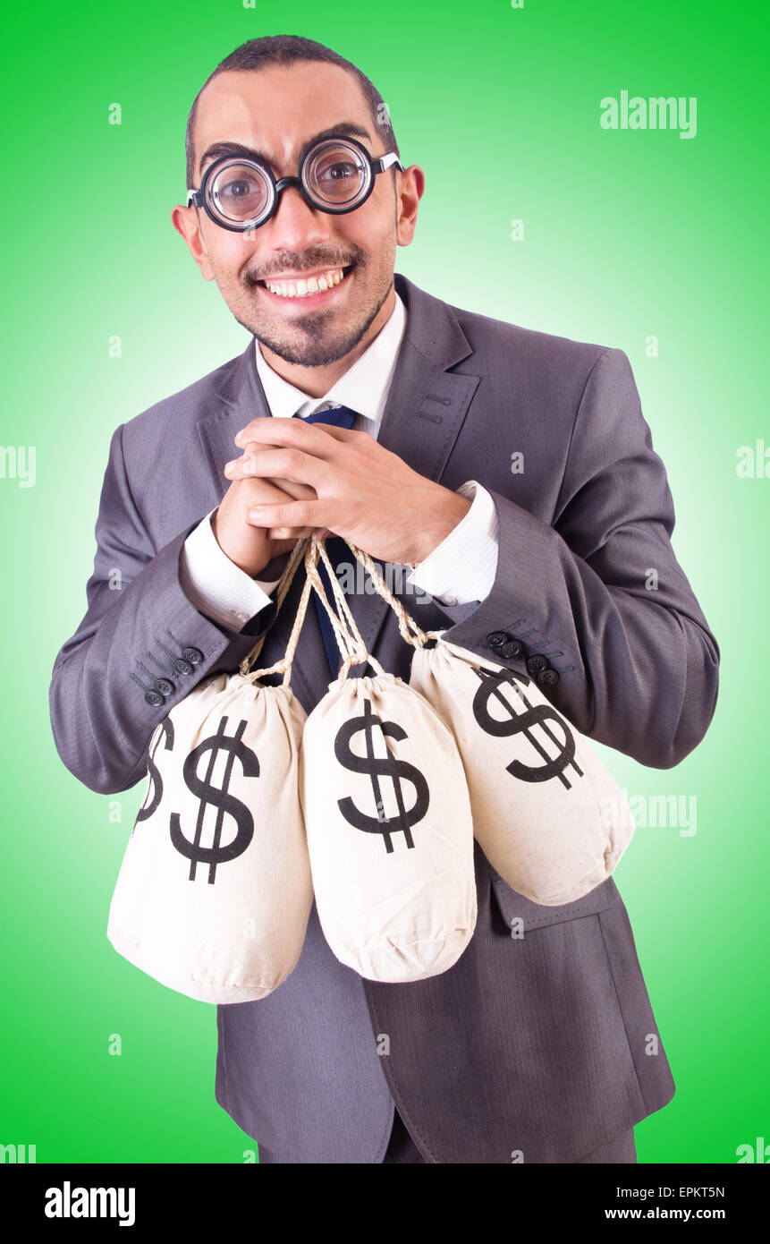 Man with sacks of money on white Stock Photo - Alamy