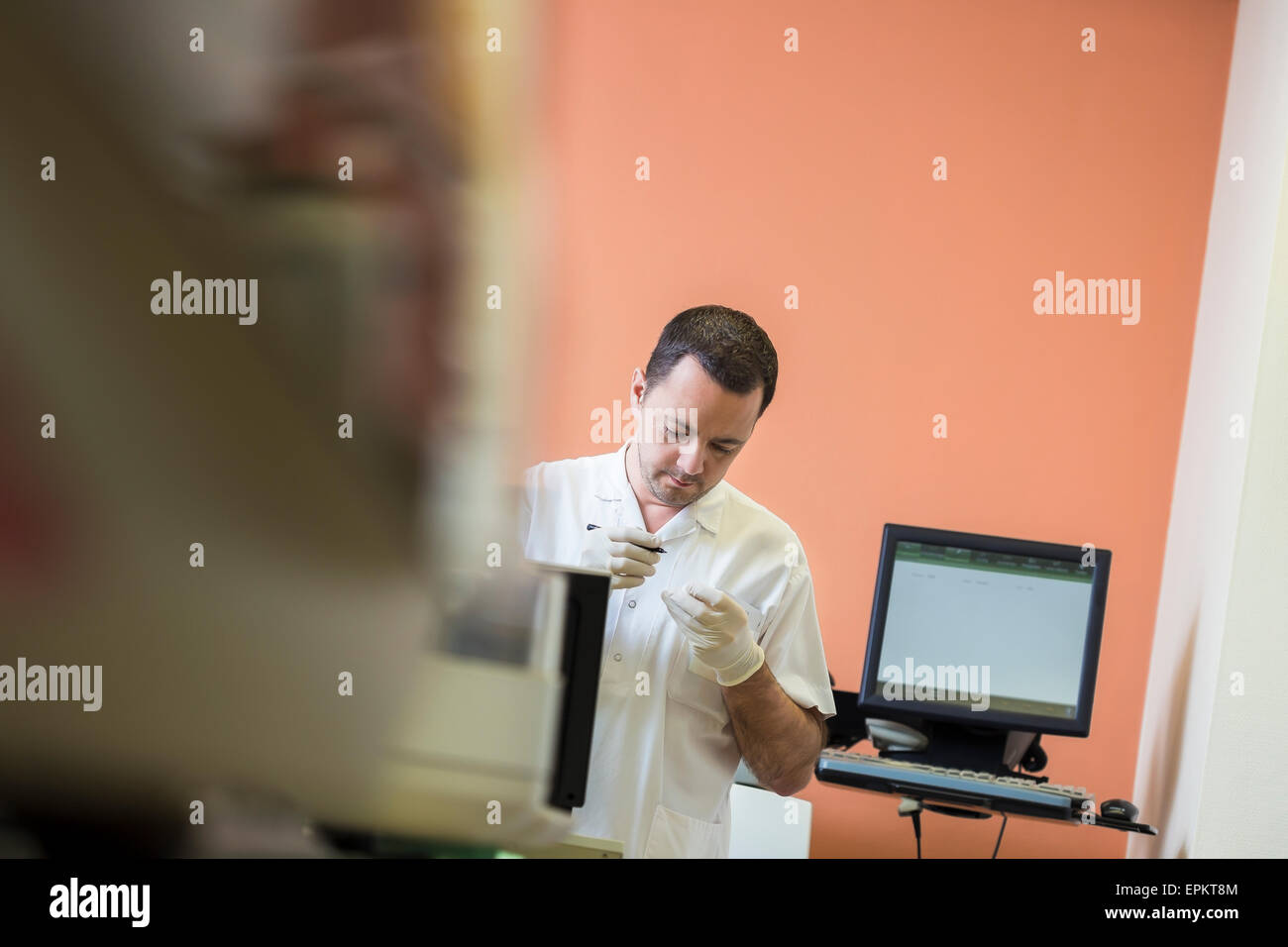 Lab technician in clinical lab Stock Photo - Alamy