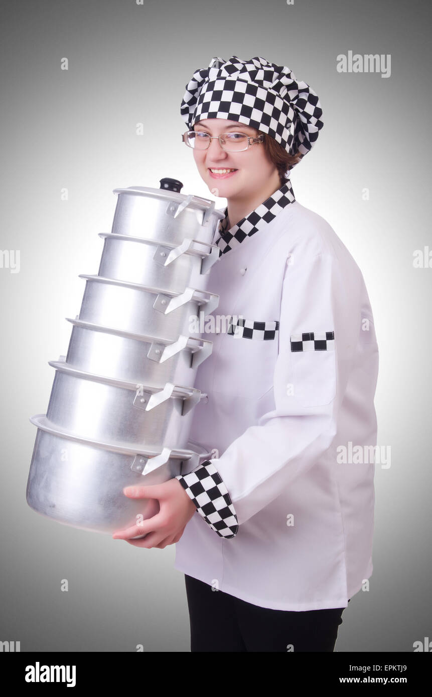 Cook with stack of pots on white Stock Photo - Alamy