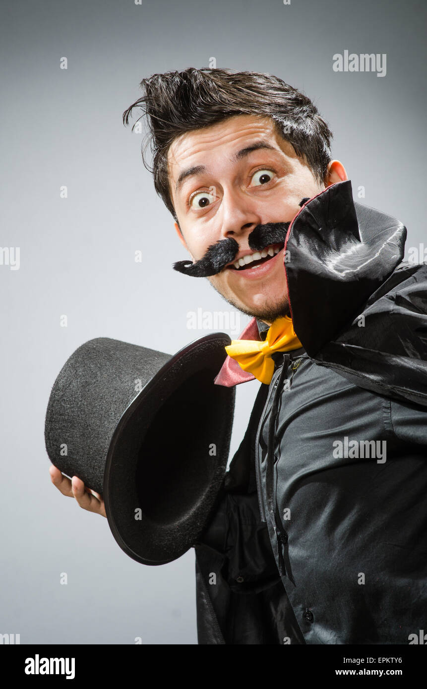 Funny magician man with wand and hat Stock Photo - Alamy