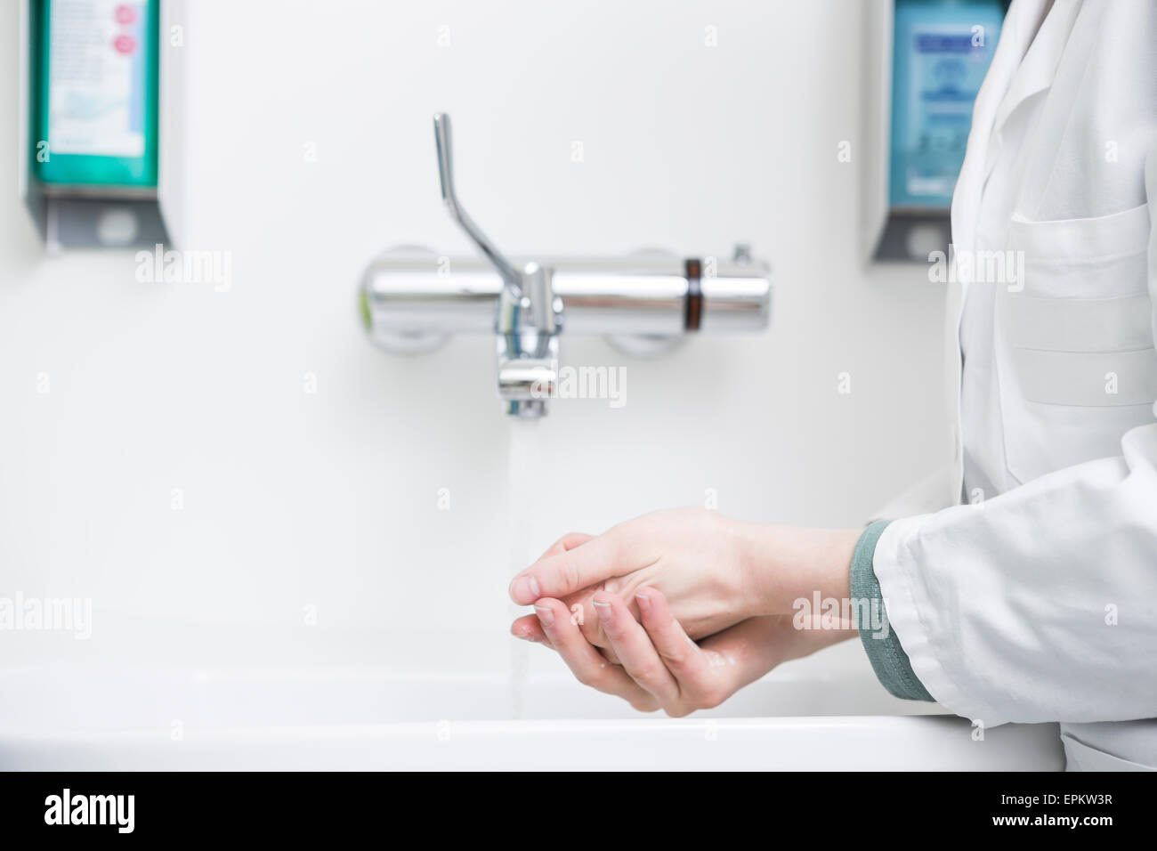 Young lab technician washing hands Stock Photo - Alamy