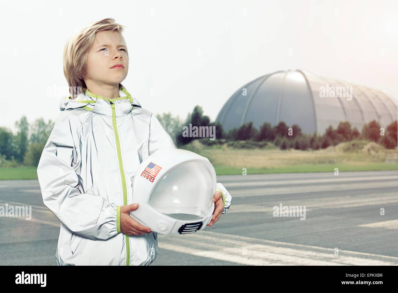 Boy dressed up as spaceman looking up Stock Photo - Alamy