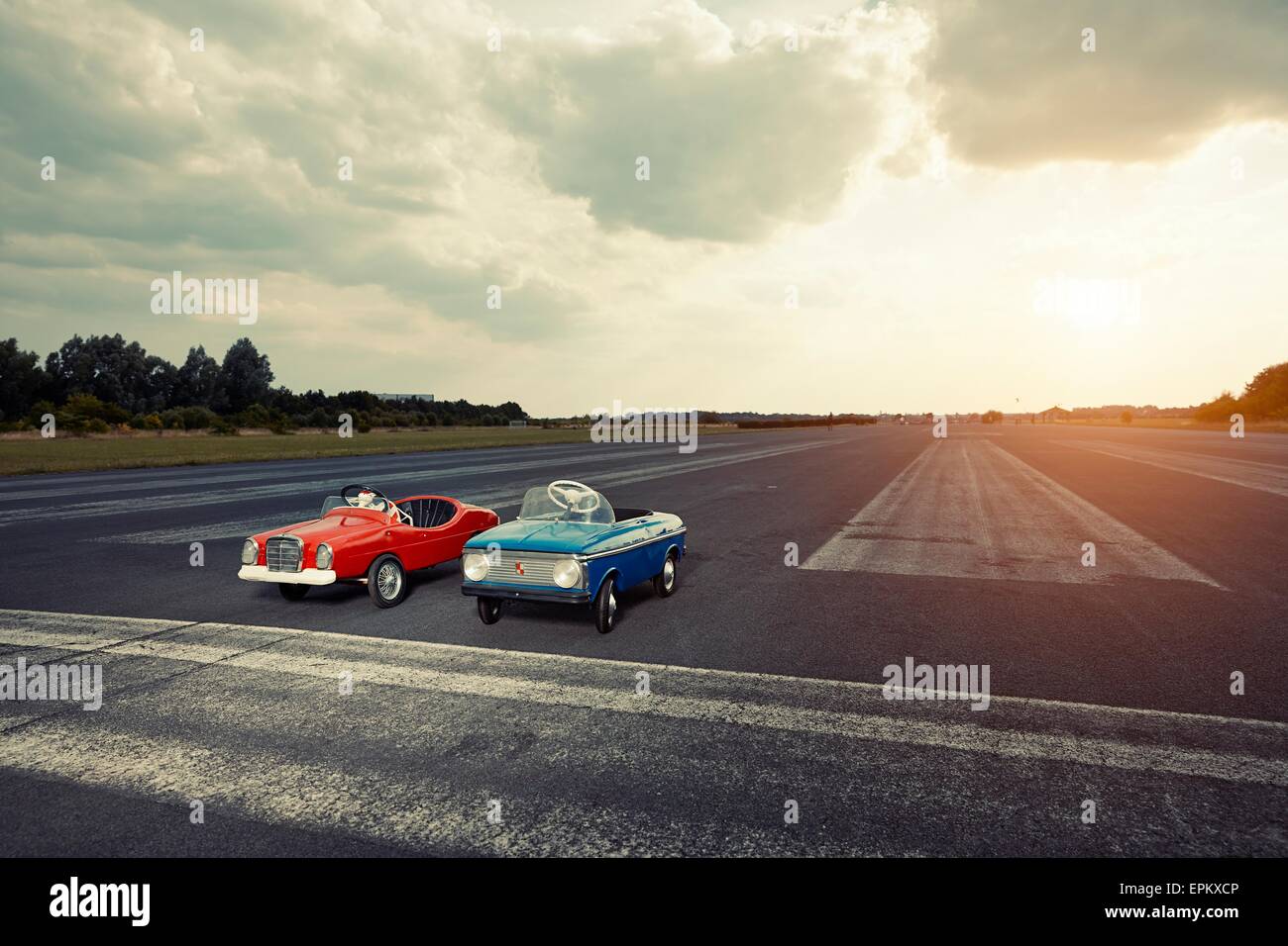 Two pedal cars at finishing line on race track Stock Photo - Alamy