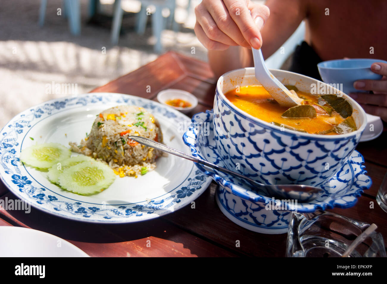 Thai red curry with king prawns and rice Stock Photo - Alamy