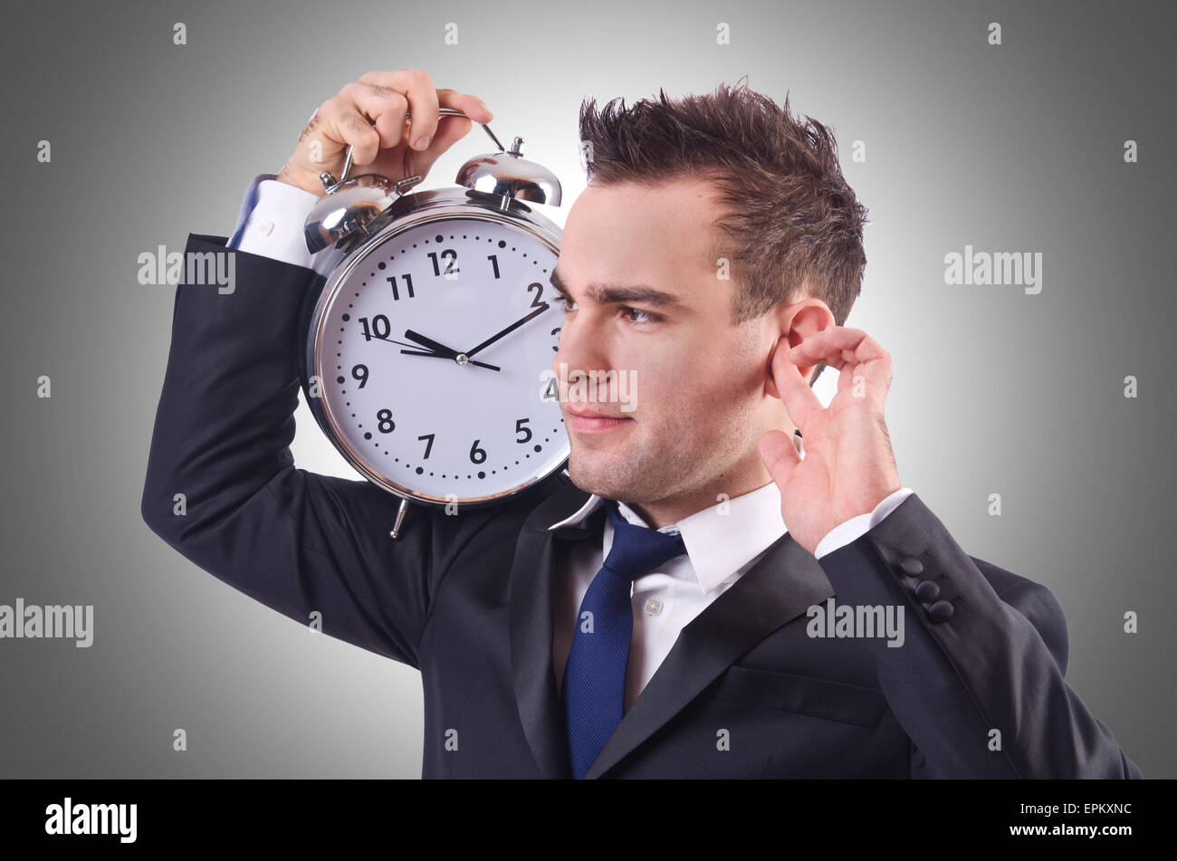 Businessman with clock isolated on white Stock Photo - Alamy