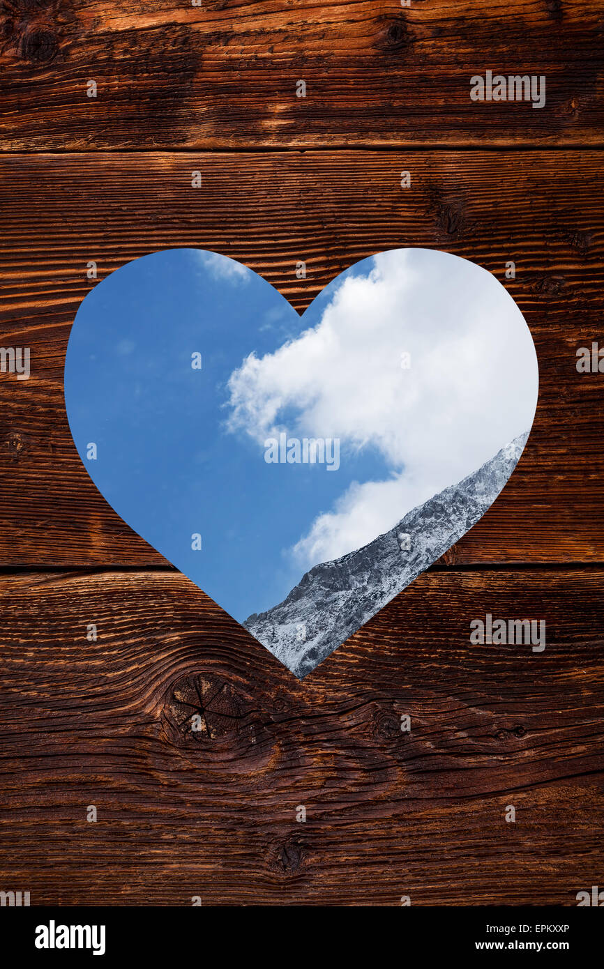 Wooden background with heart shape window with Austrian Alps in it ...