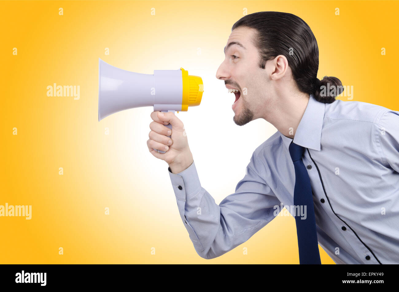 Man shouting and yelling with loudspeaker Stock Photo - Alamy