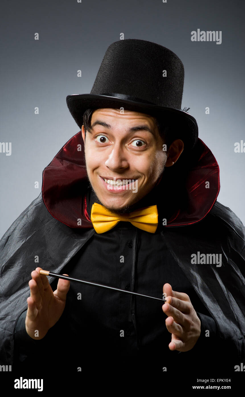 Funny magician man with wand and hat Stock Photo - Alamy