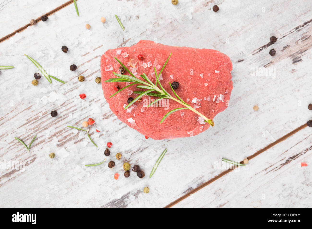Luxurious raw sirloin steak on white textured kitchen table, top view ...