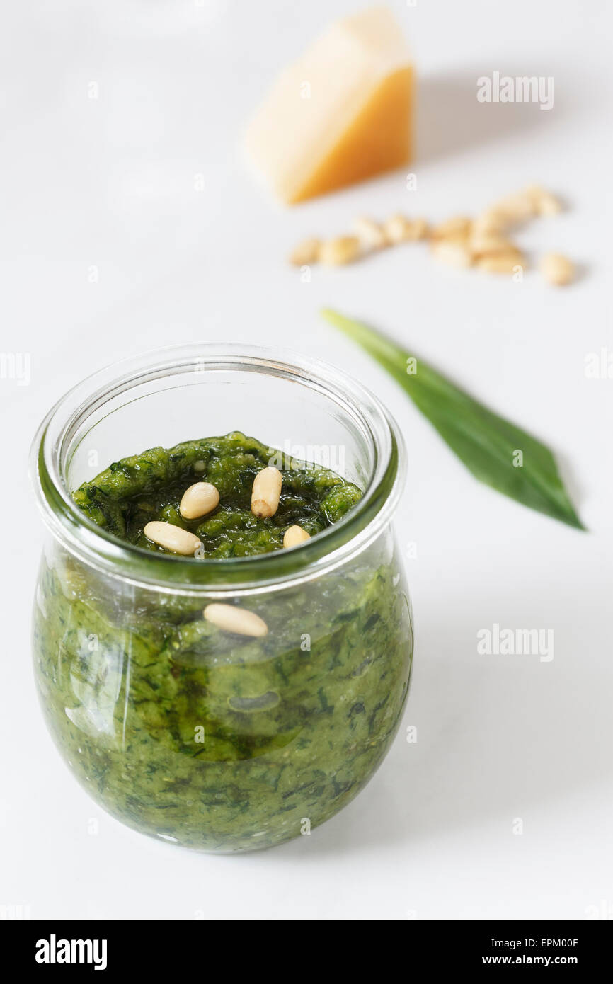Homemade ramson pesto, parmesan, leaf and pine nuts on wood Stock Photo ...