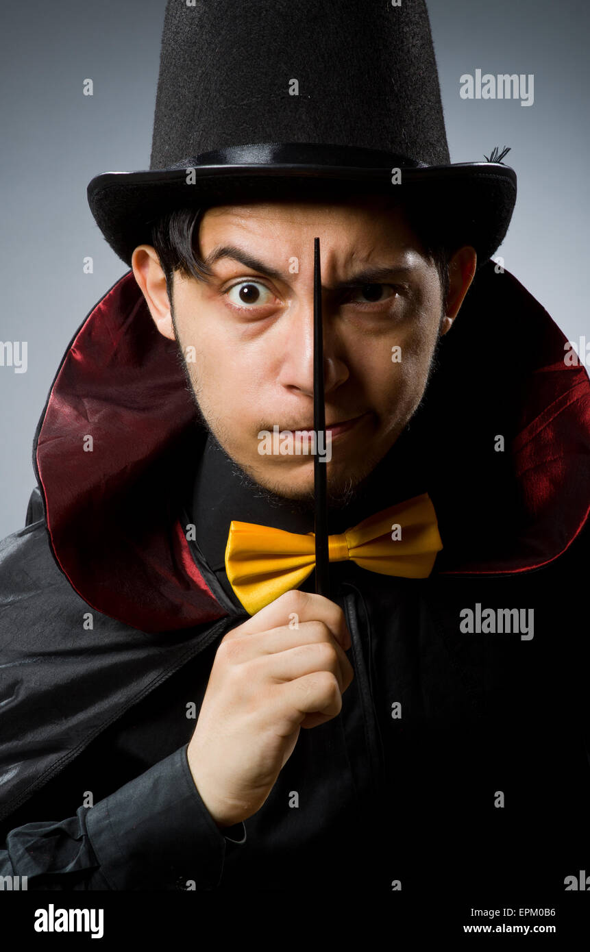 Funny magician man with wand and hat Stock Photo - Alamy
