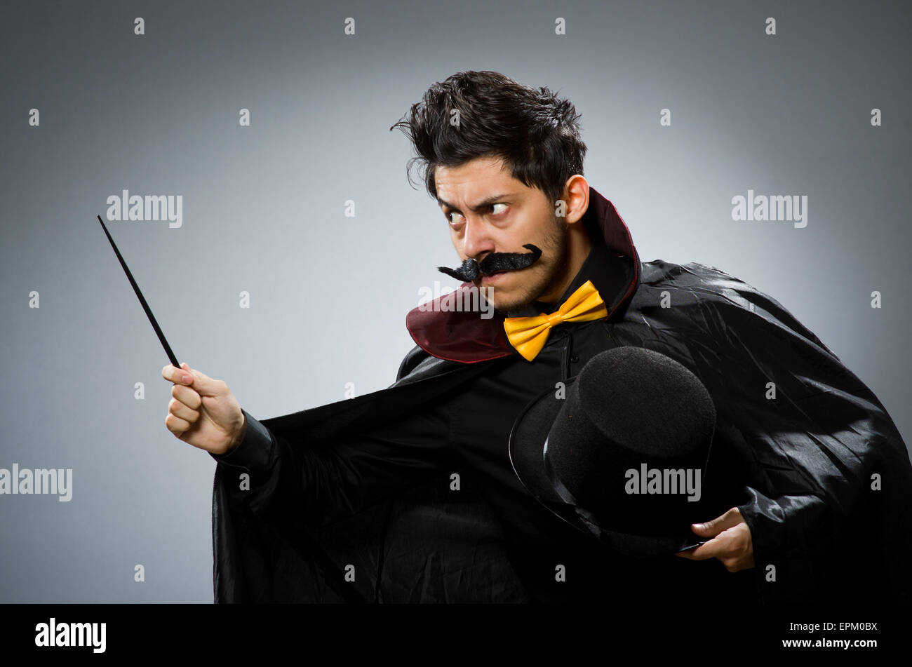 Funny magician man with wand and hat Stock Photo - Alamy