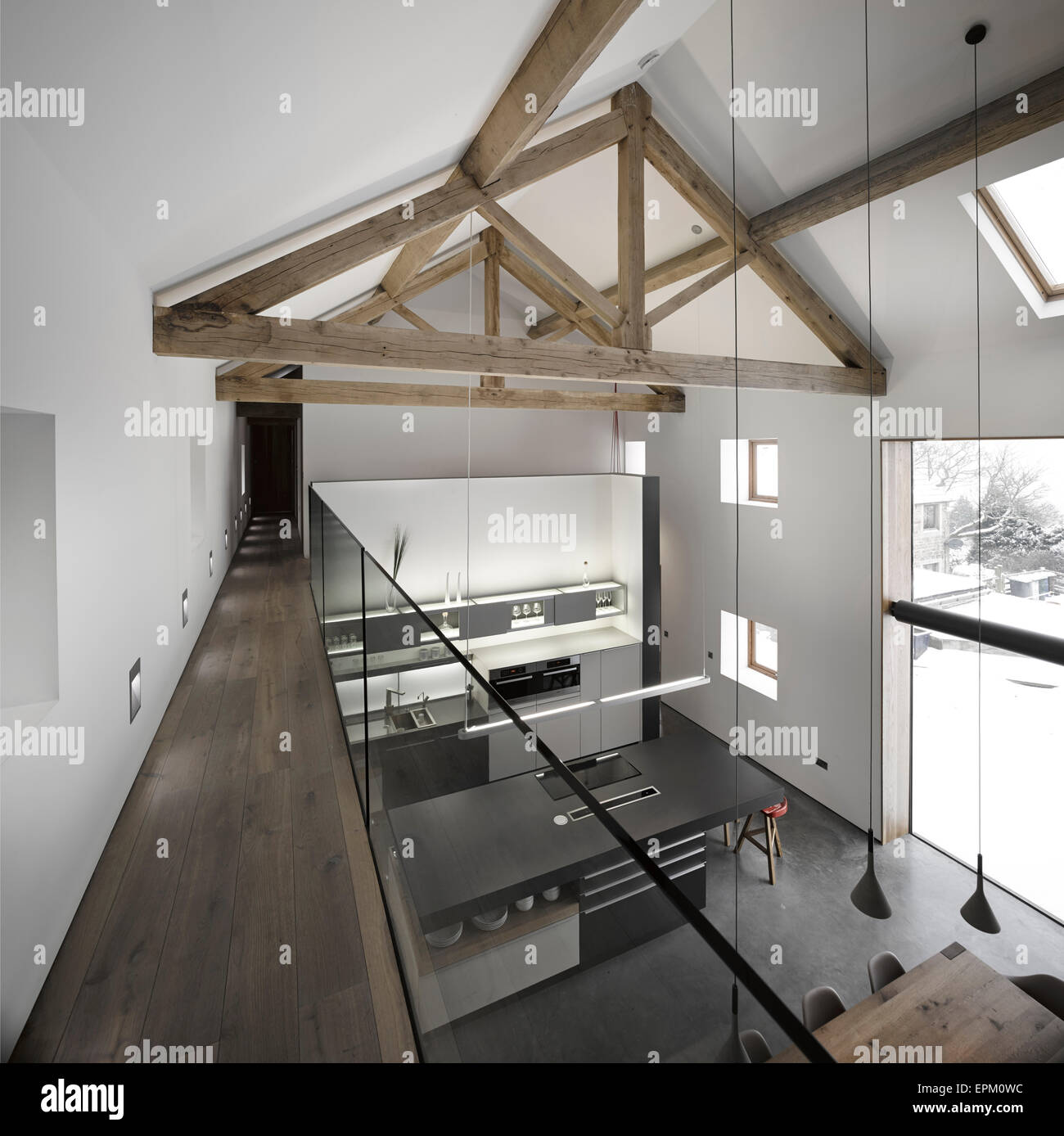 Internal balcony with glass banister overlooking kitchen, Cat Hill Barn ...