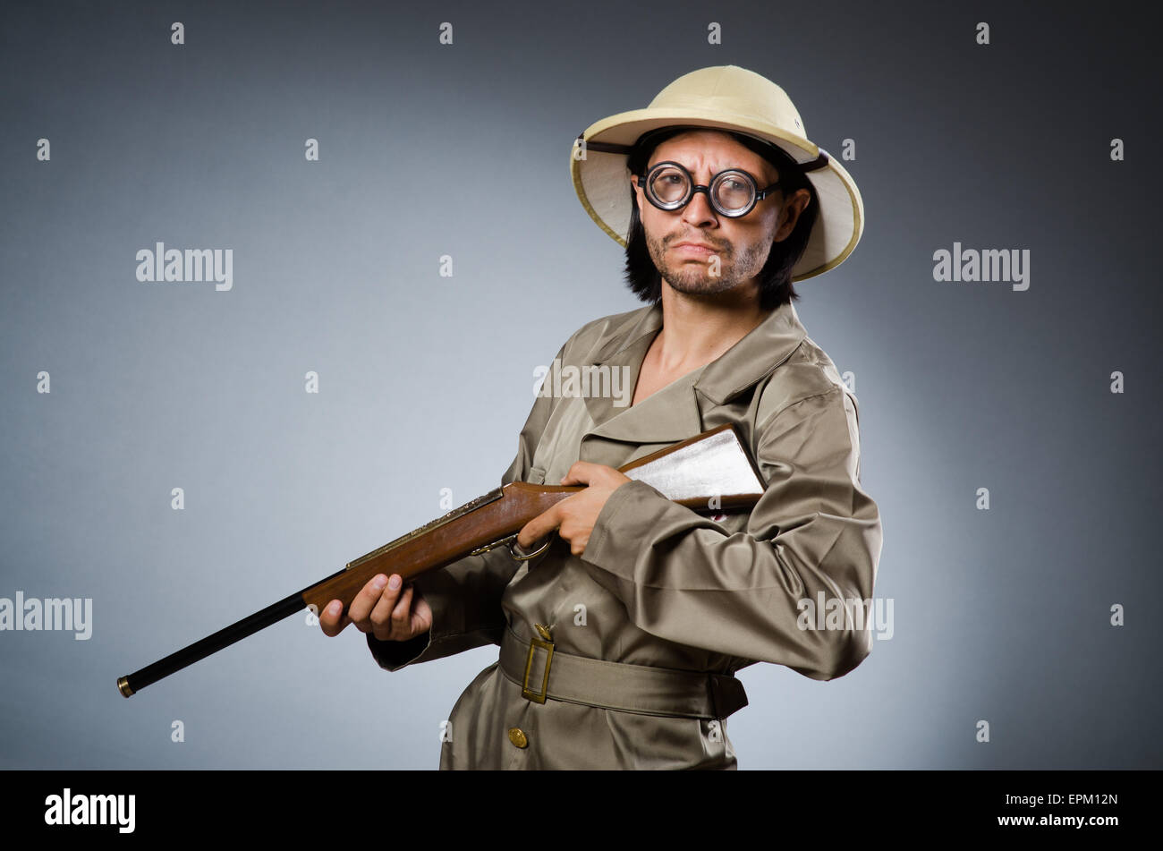 Funny safari hunter with rifle Stock Photo - Alamy