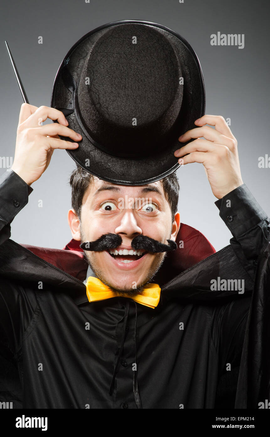 Funny magician man with wand and hat Stock Photo - Alamy