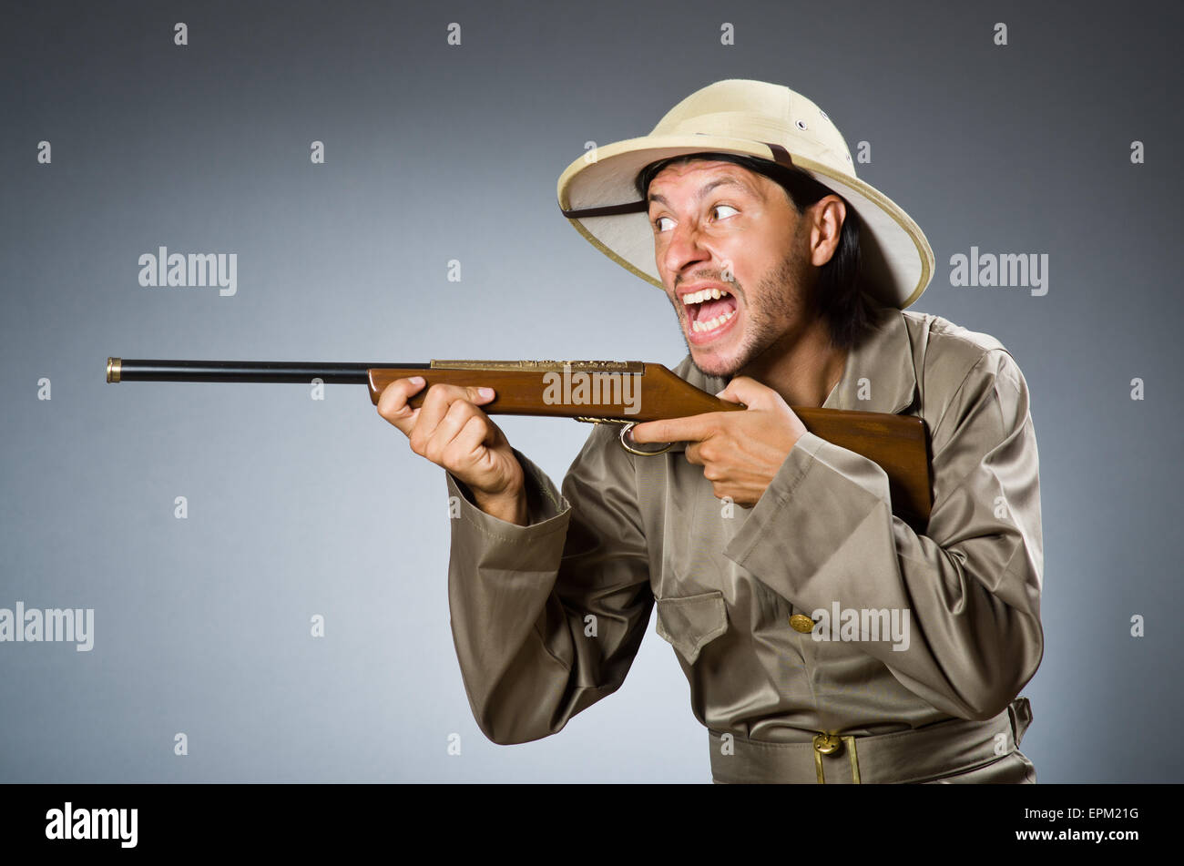 Funny safari hunter with rifle Stock Photo - Alamy