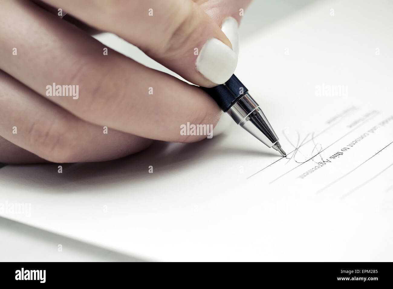Female hand signing contract Stock Photo - Alamy