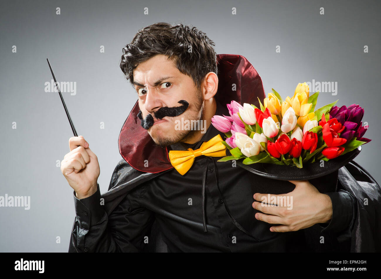 Funny magician man with wand and hat Stock Photo - Alamy