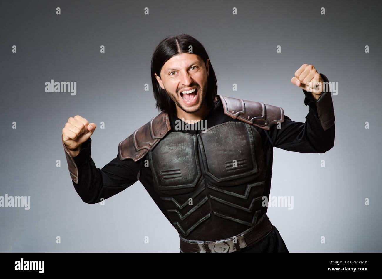 Angry warrior against dark background Stock Photo - Alamy