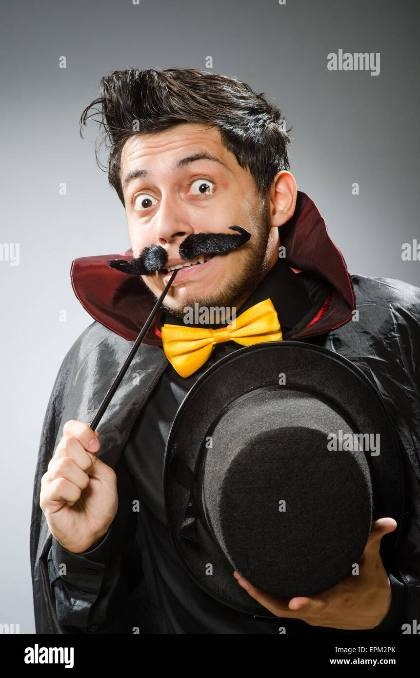 Funny magician man with wand and hat Stock Photo - Alamy