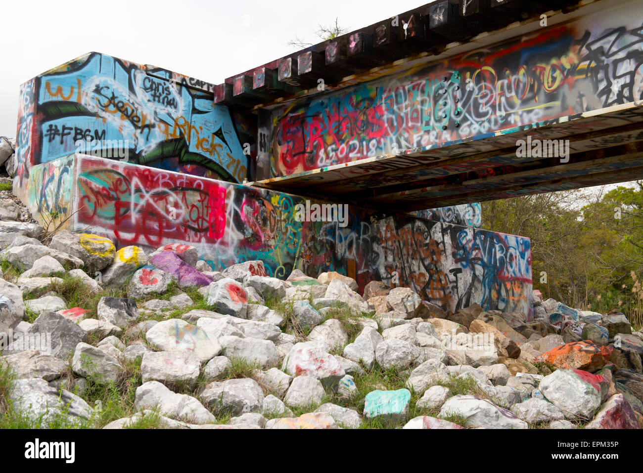 Graffiti on overhead train track Stock Photo - Alamy