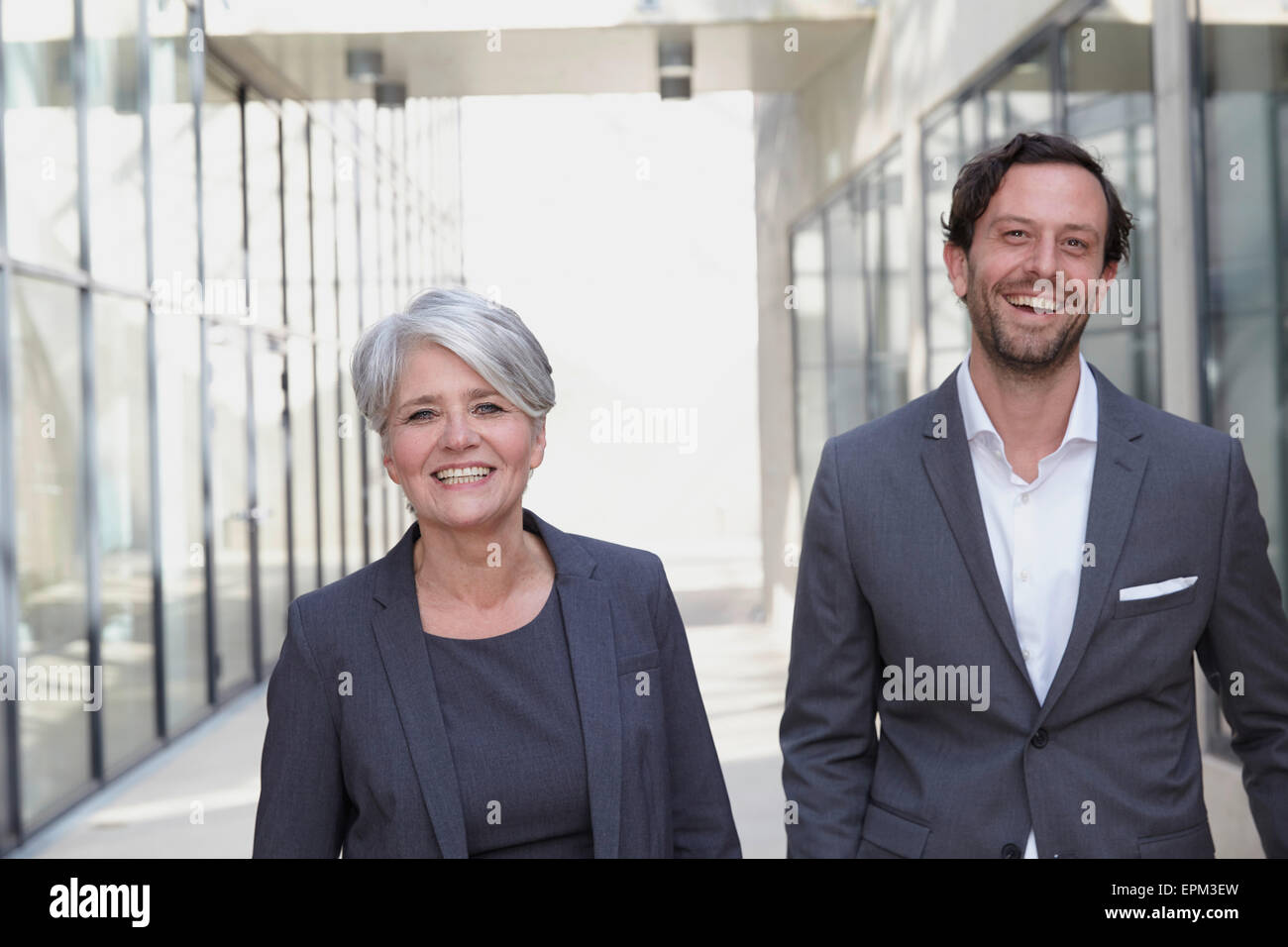 Portrait of two smiling business people Stock Photo - Alamy