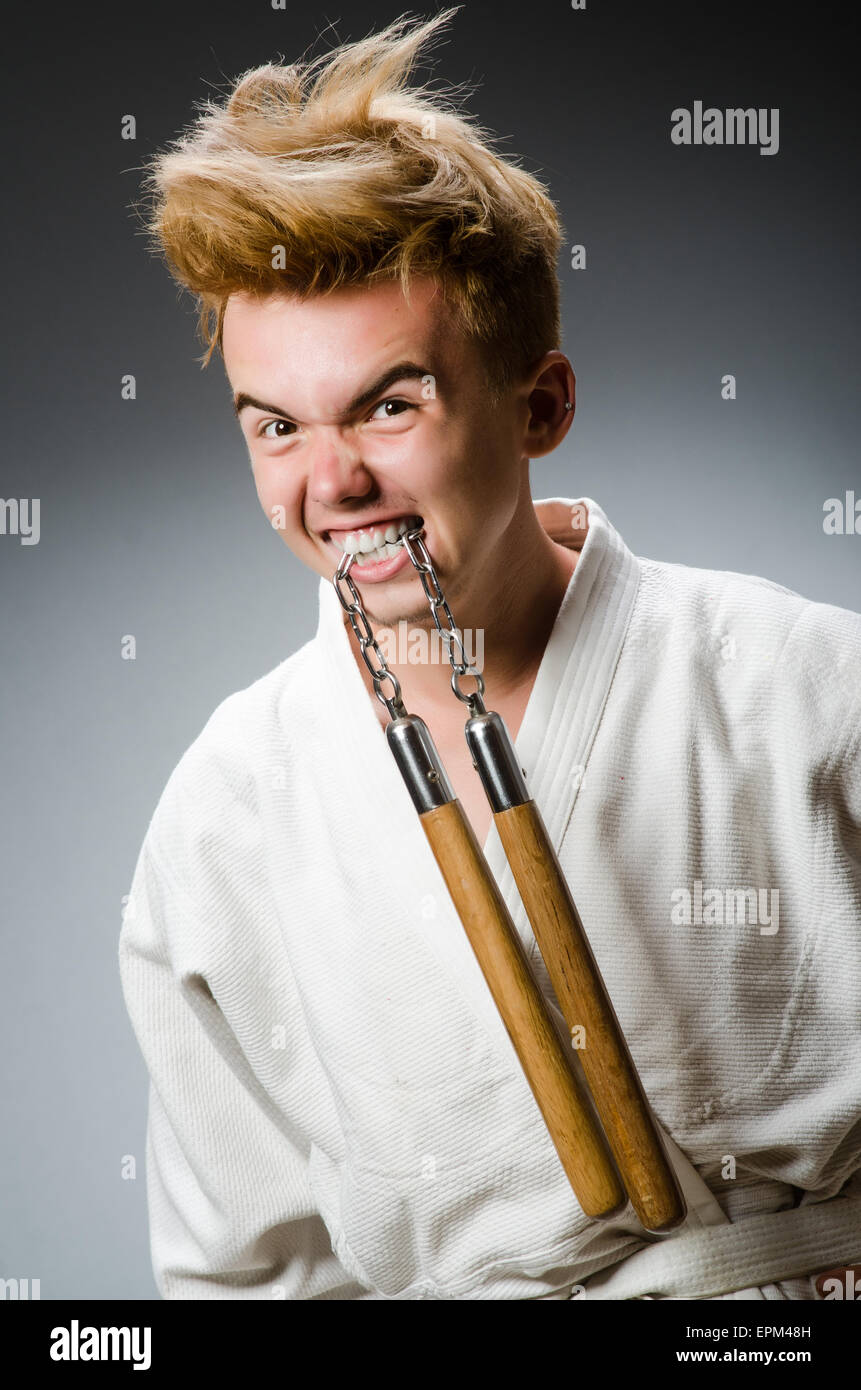 Funny karate fighter with nunchucks Stock Photo - Alamy