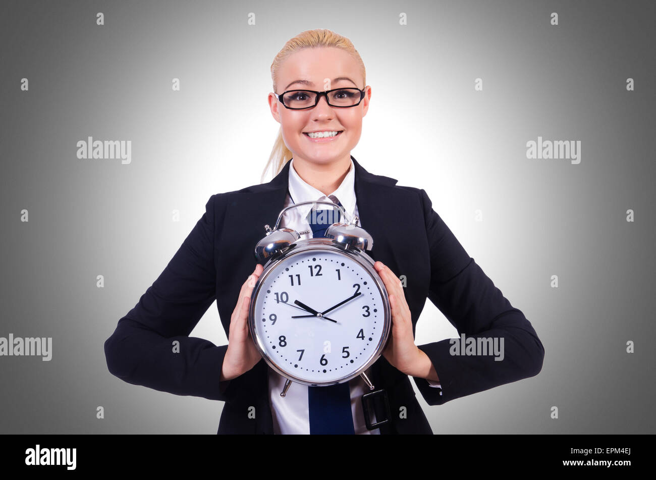 Woman with giant clock on white Stock Photo - Alamy