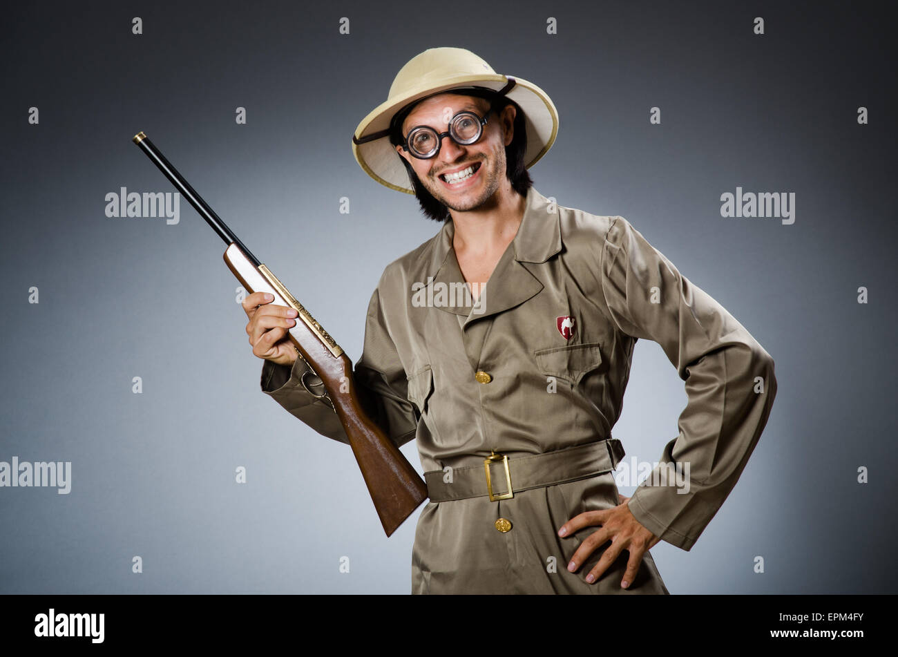 Funny safari hunter with rifle Stock Photo - Alamy