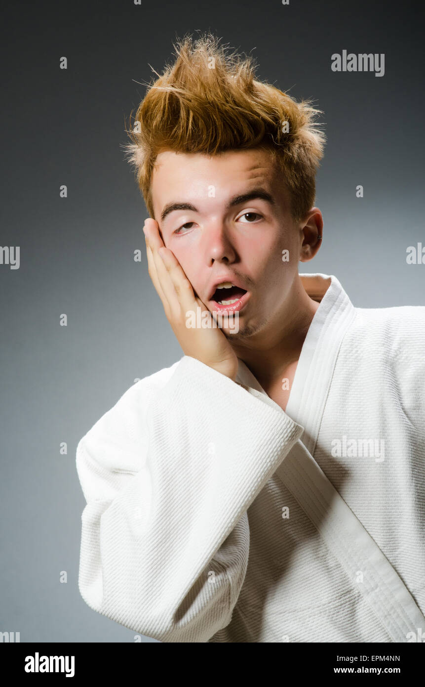 Funny karate fighter wearing white kimono Stock Photo - Alamy